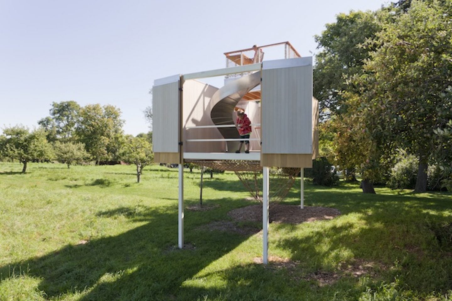 The Playful Tree House With A Slide And Climbing Net - IGNANT
