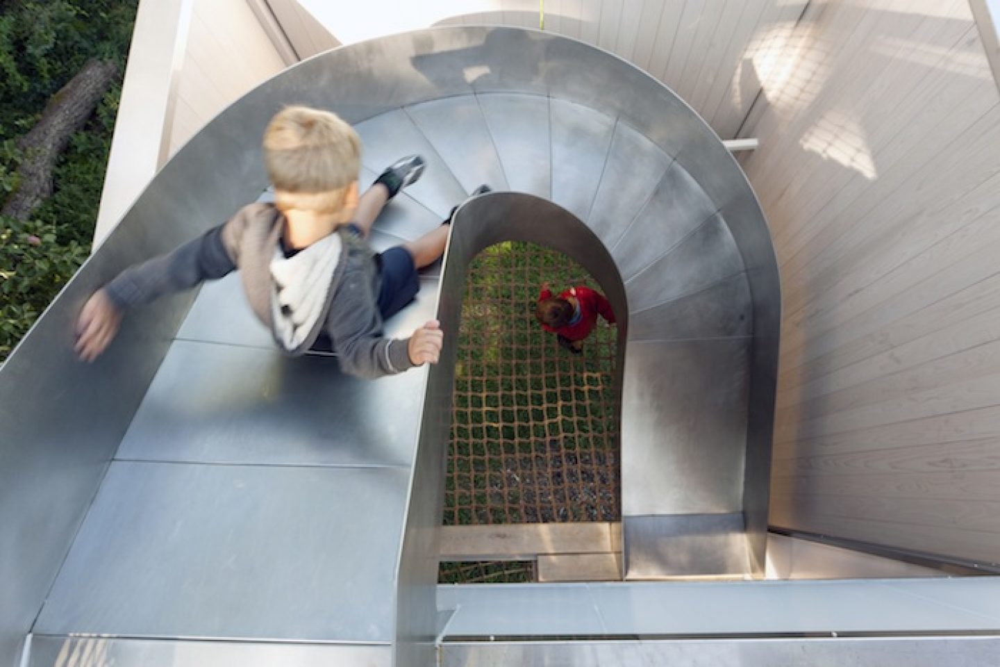 The Playful Tree House With A Slide And Climbing Net - IGNANT