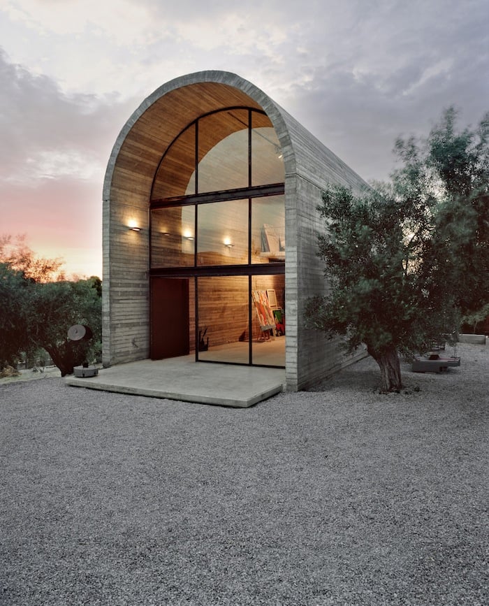 A Curved Concrete Art Warehouse By A31 Architecture - IGNANT