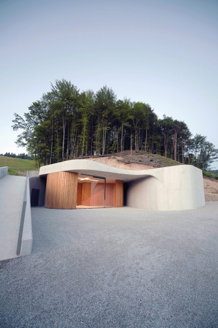 A Curved Concrete Chapel By OFIS Architects - IGNANT