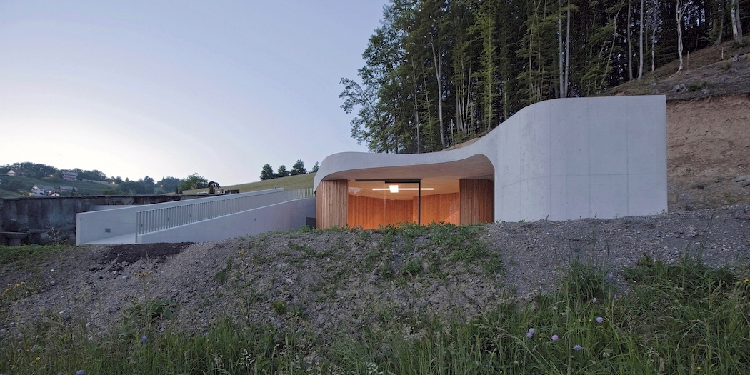 A Curved Concrete Chapel By OFIS Architects - IGNANT