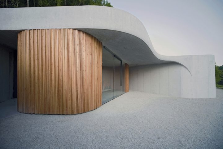 A Curved Concrete Chapel By OFIS Architects - IGNANT