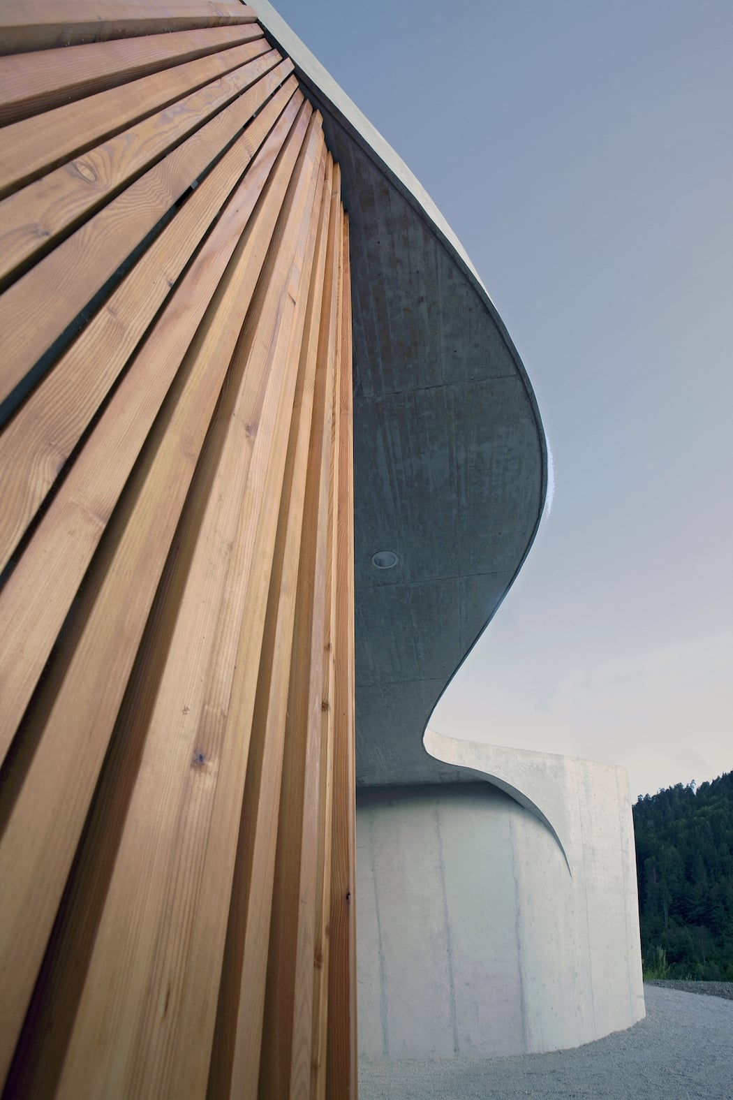 A Curved Concrete Chapel By OFIS Architects - IGNANT