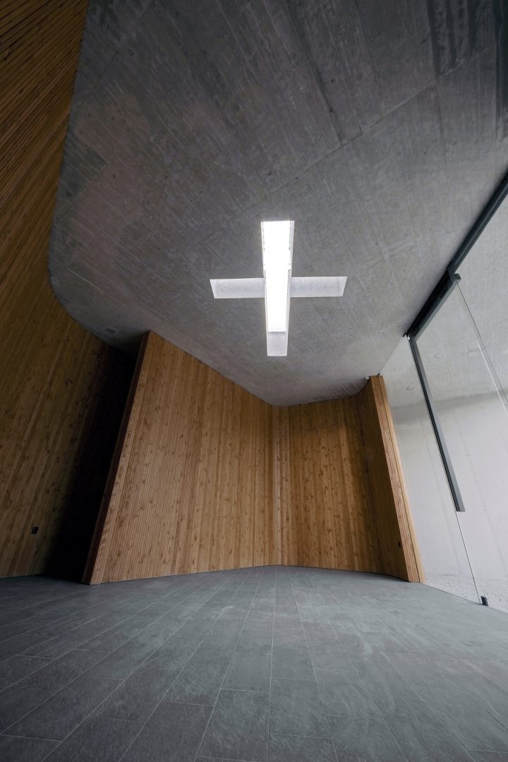 A Curved Concrete Chapel By OFIS Architects - IGNANT