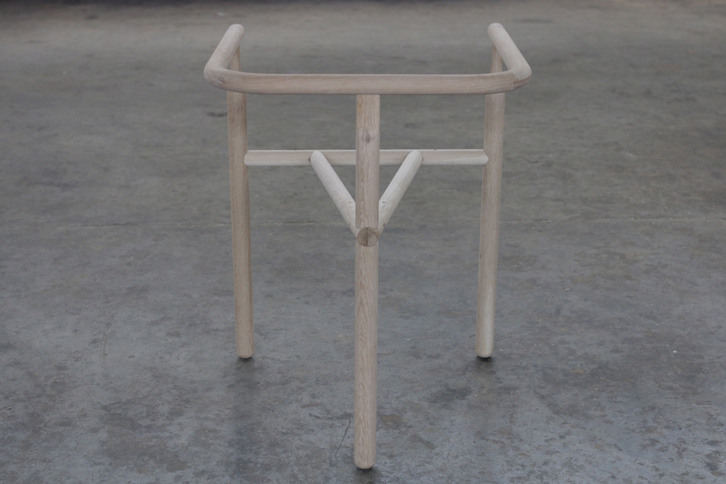 A Three-Legged Wooden Chair By Milk Design - IGNANT