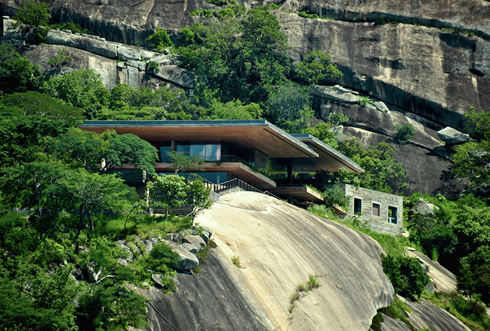 A House On A Rock Overlooking A Dam - IGNANT