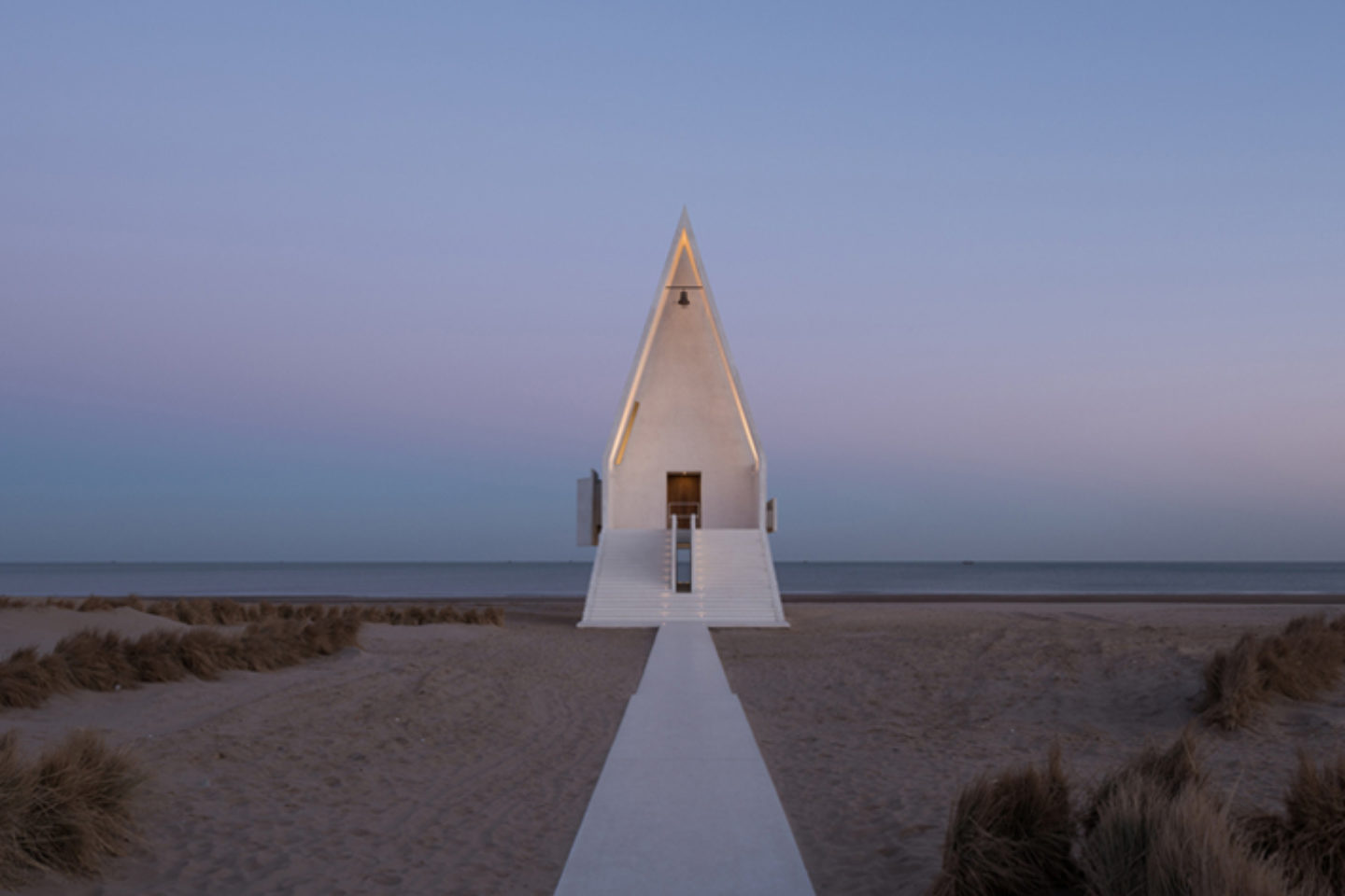 A Curved Concrete Chapel By OFIS Architects - IGNANT