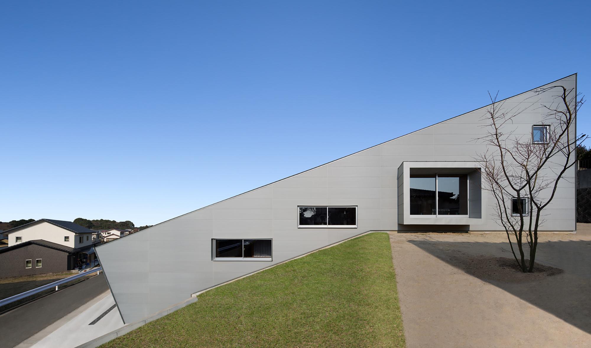 A Home Comprised Of Levels Edges Down A Hill In Munakata, Japan - IGNANT