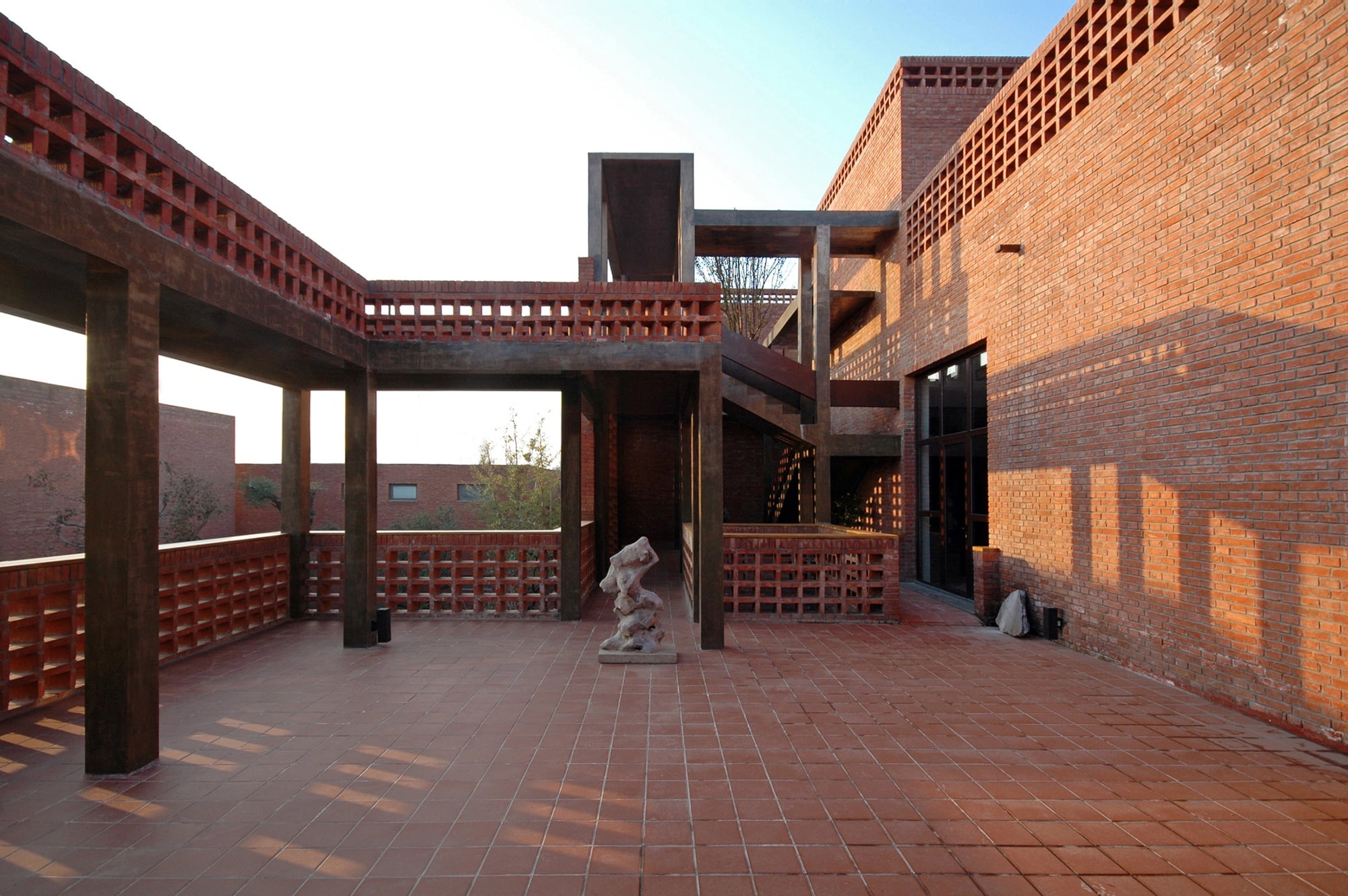 A Labyrinth-Like Red Brick Atelier For Two Renowned Sculptors In ...